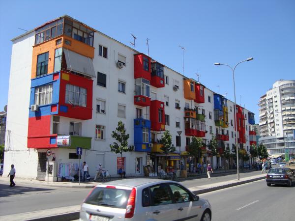 Old commie building painted with bright colors - Tirana