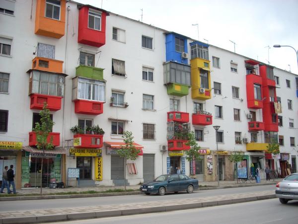 Old commie building painted with bright colors - Tirana