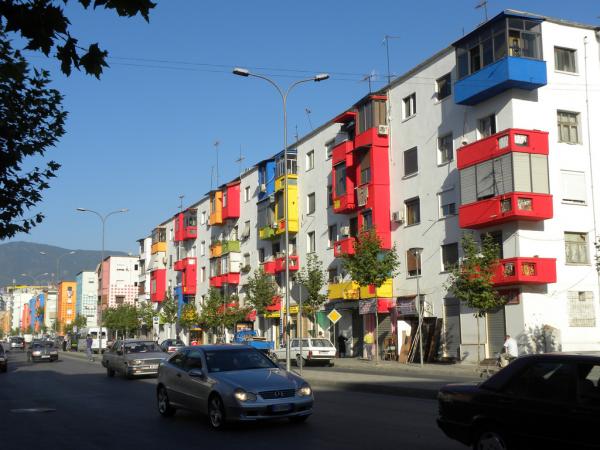 Old commie building painted with bright colors - Tirana