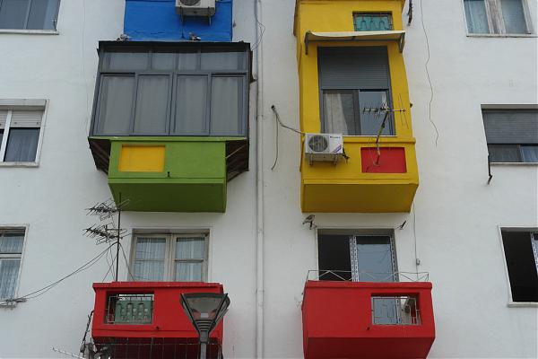 Old commie building painted with bright colors - Tirana