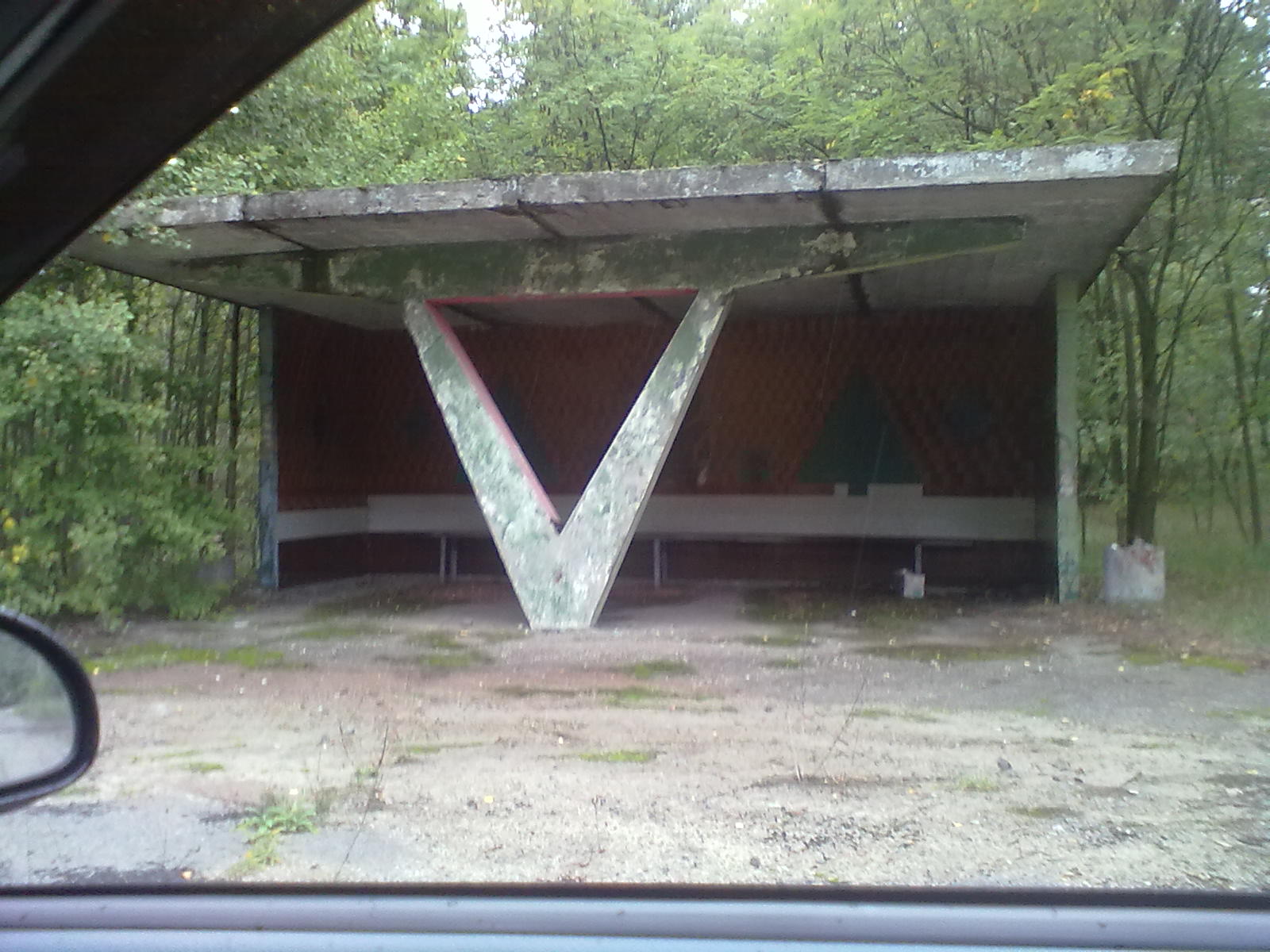 Concrete bus stop & Stop sign