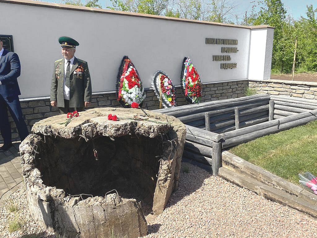 Reinforced concrete pillbox with the wooden dugout
